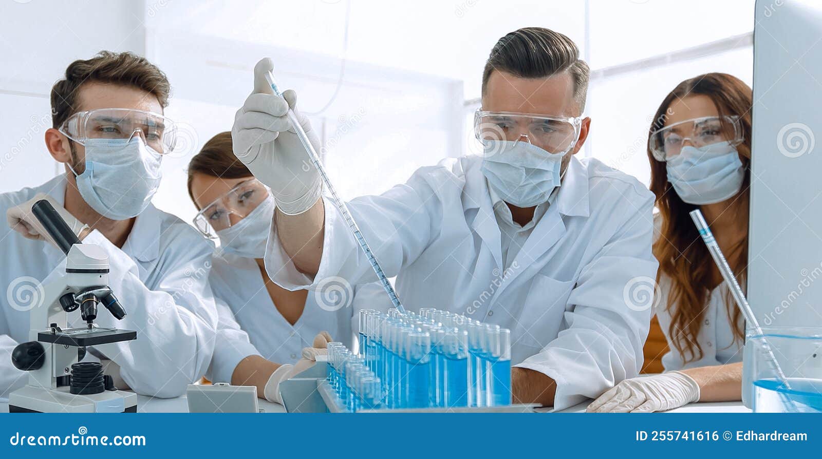 Medical Doctors are Working with Test Tubes and Microscope at Th Stock ...