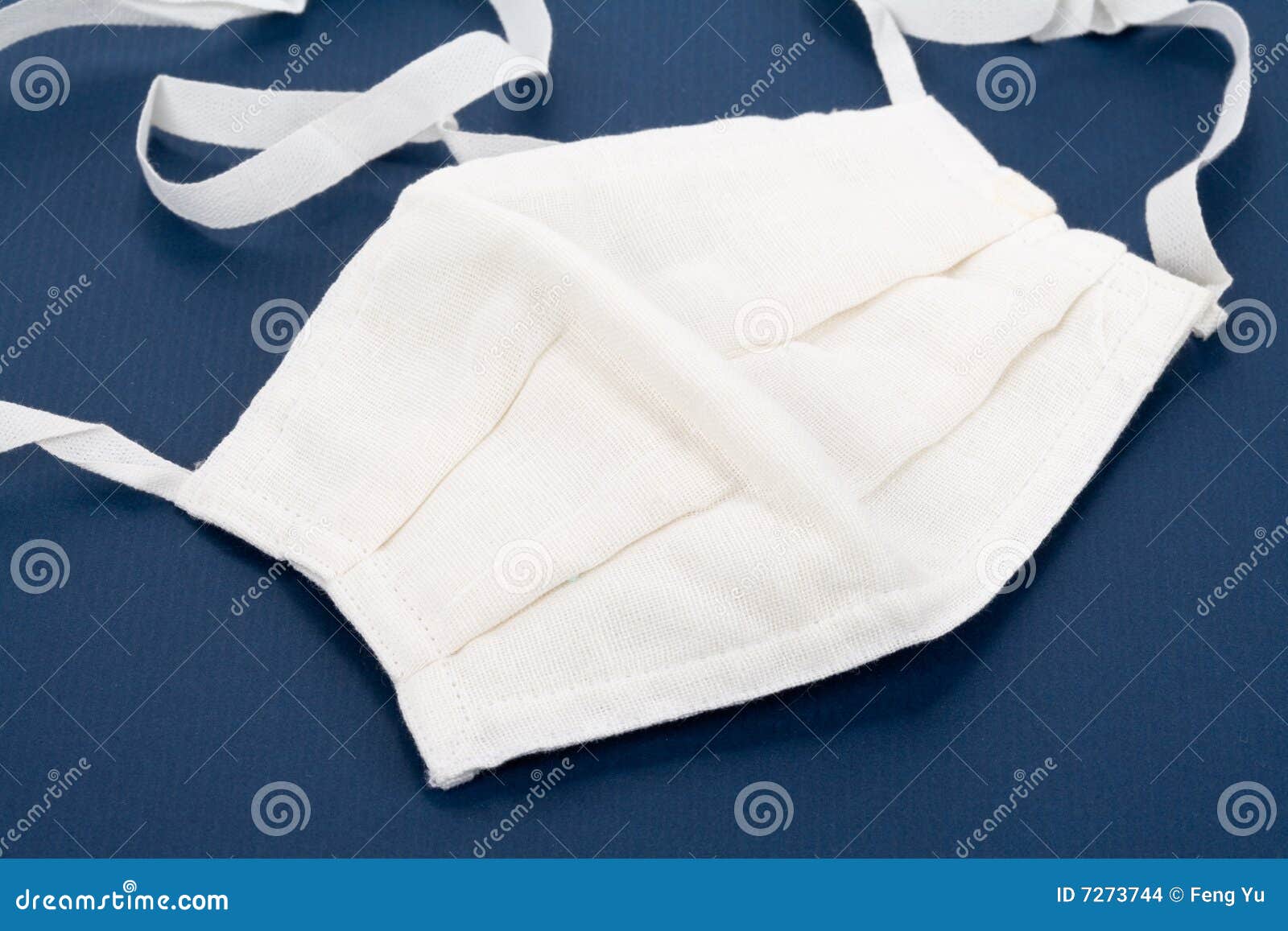 A Face Mask And A Face Shield Placed On A White Surface. To Use For ...