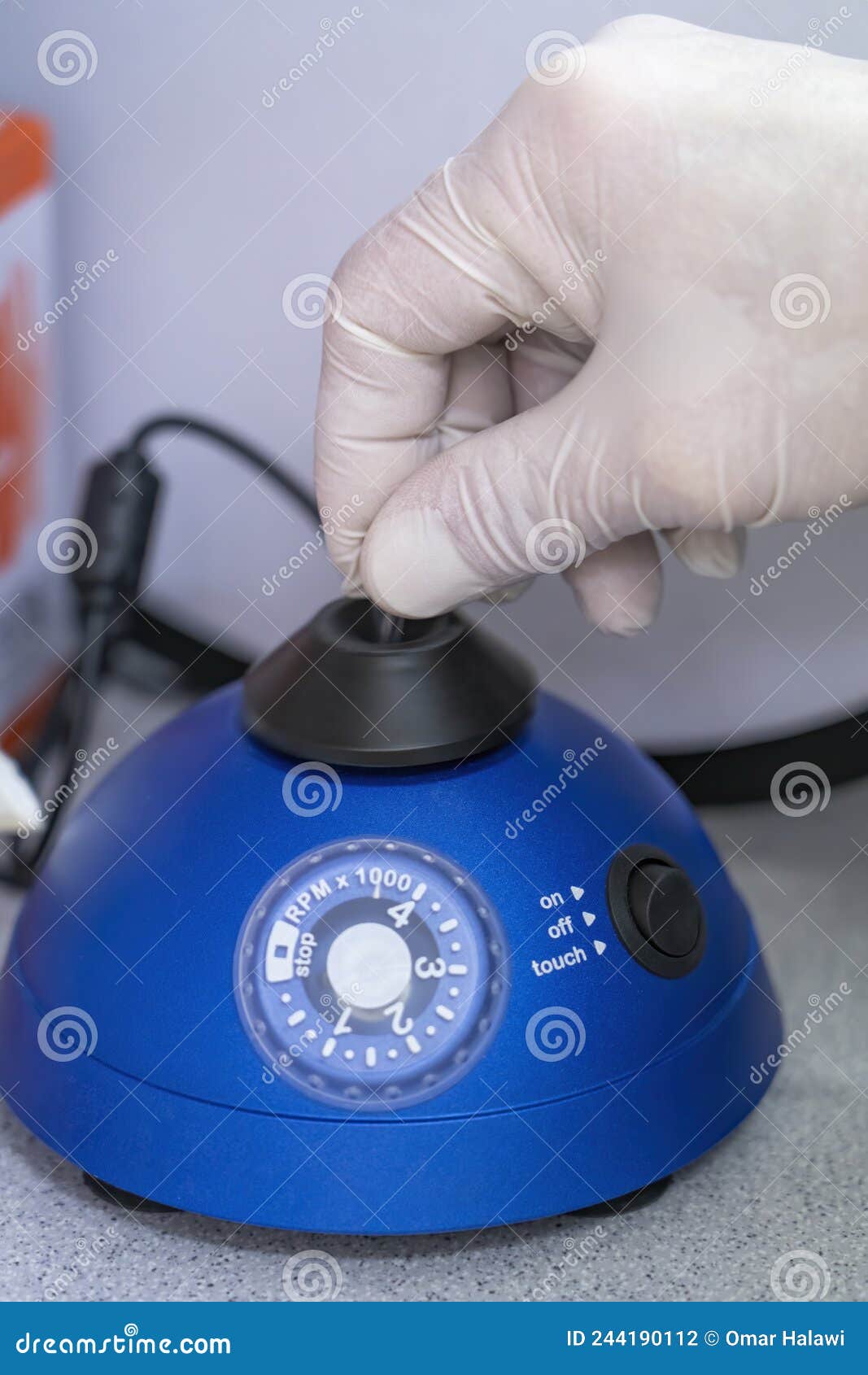 Medical Lab Scientists in Laboratory Using Vortex Mixer To Mix a ...
