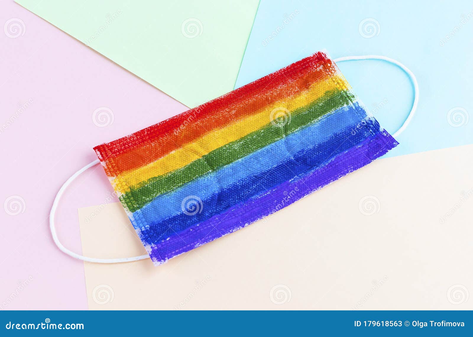 Medical Mask with a Rainbow Drawn on Multicolored Paper Stock Image ...