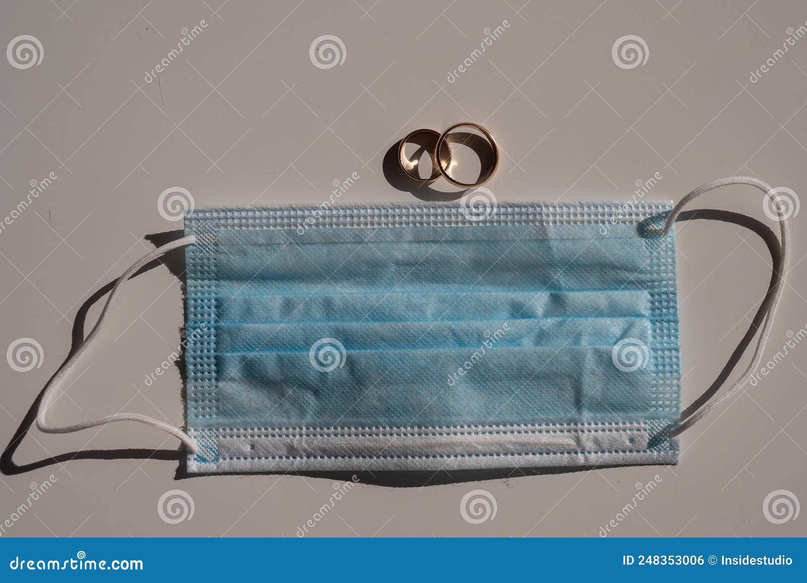 Medical Mask and Wedding Rings on White Table. Stock Photo - Image of ...