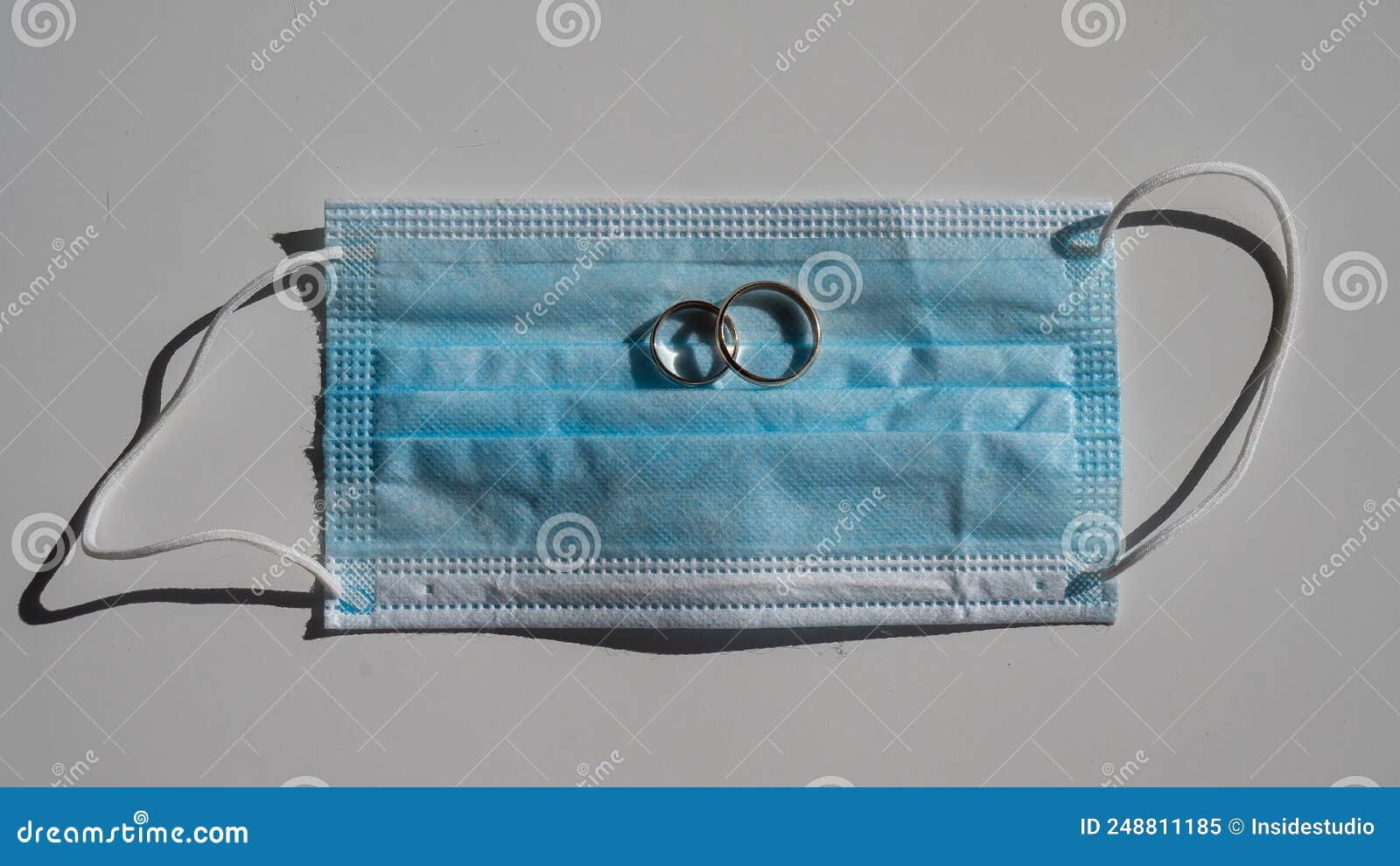 Medical Mask and Wedding Rings on White Table. Stock Image - Image of ...