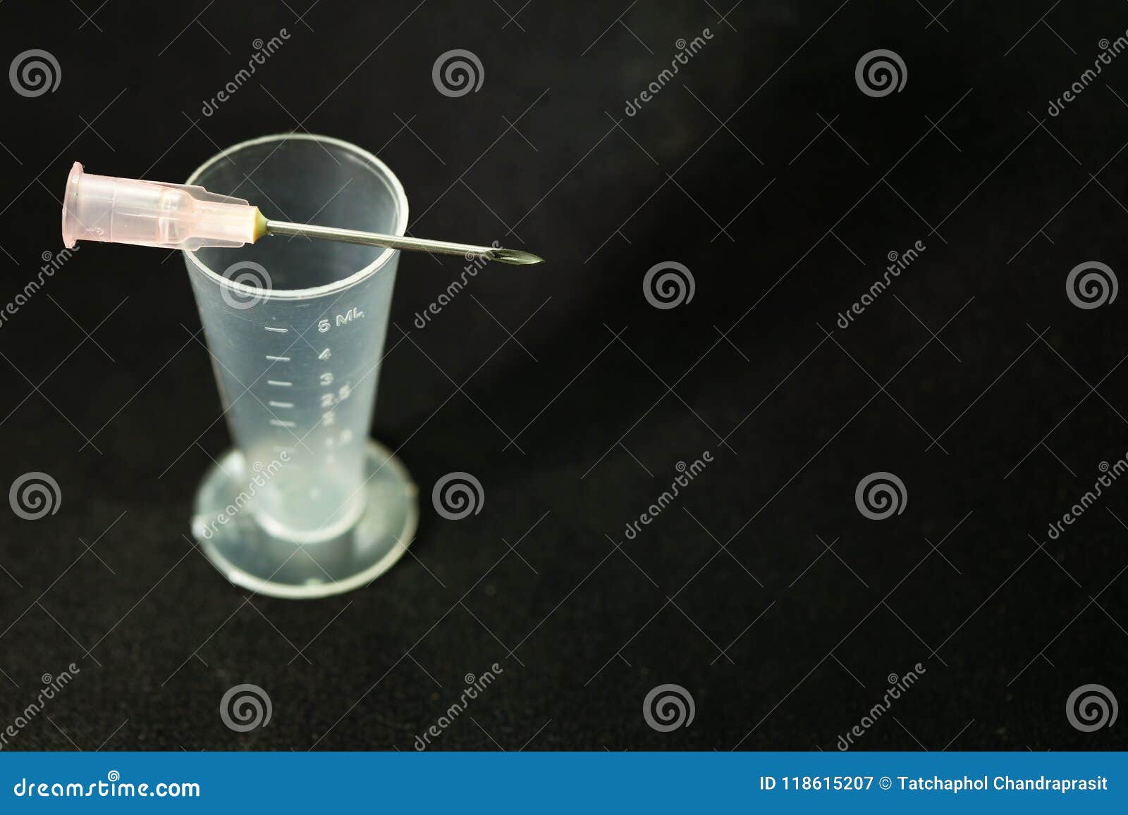 Needle on cup scene. stock image. Image of medicine - 118615207