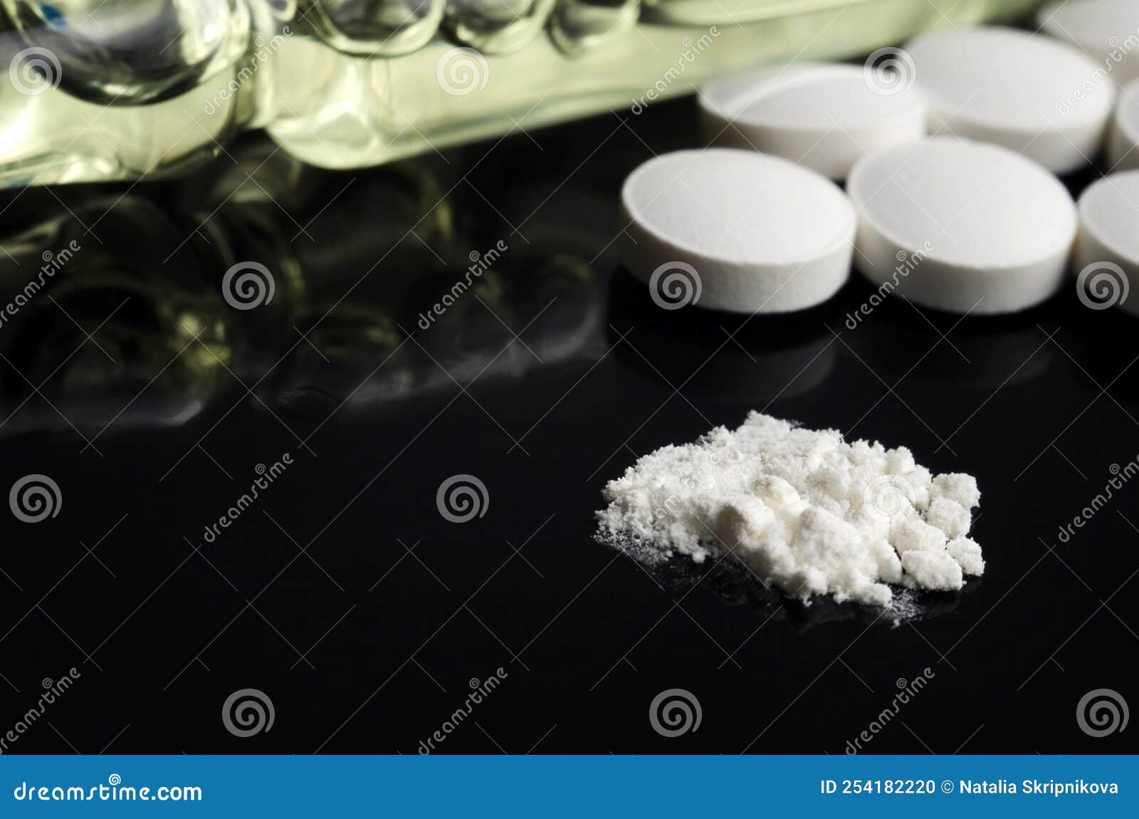 White Powder and Tablets on a Black Background Stock Photo - Image of ...