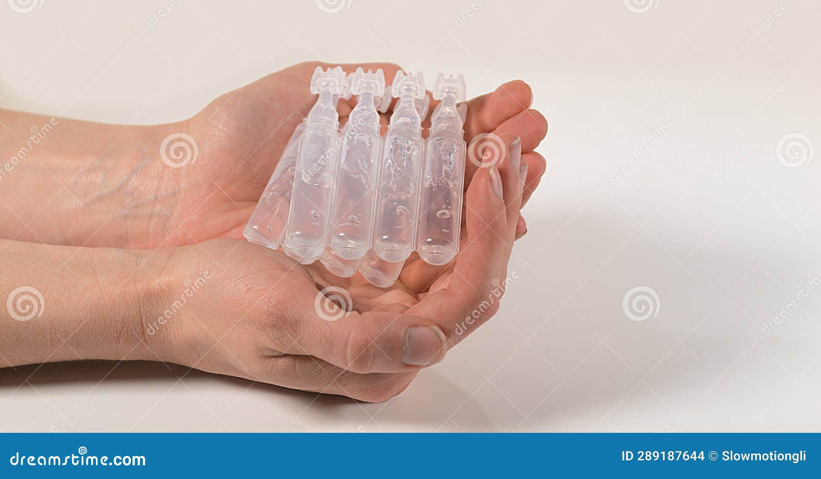Medical Product Falling into Hand Against White Background Stock Photo ...