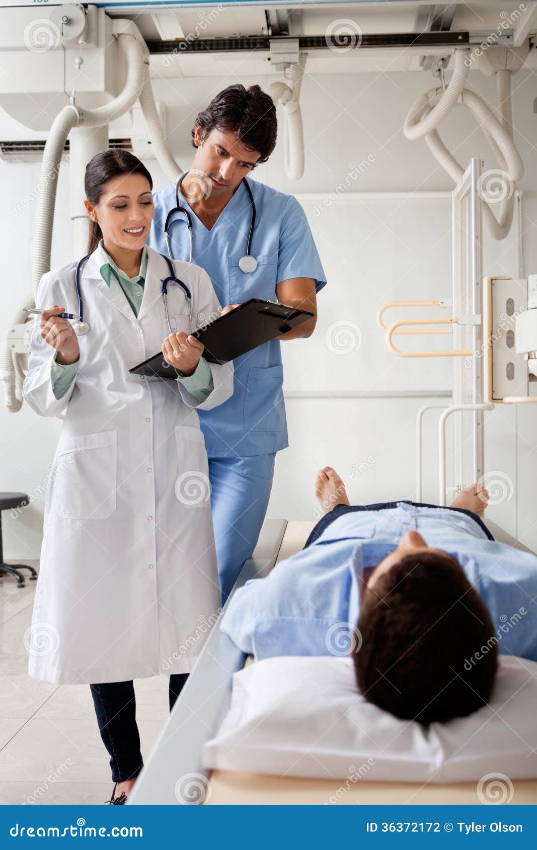 Medical Professionals Communicating with Patient Stock Photo - Image of ...