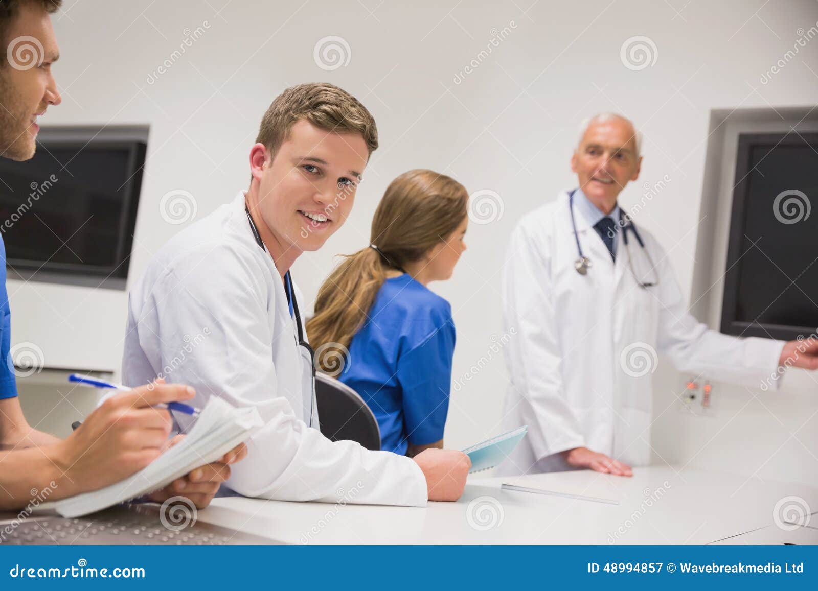 Medical Professor Teaching Young Students Stock Image - Image of happy ...