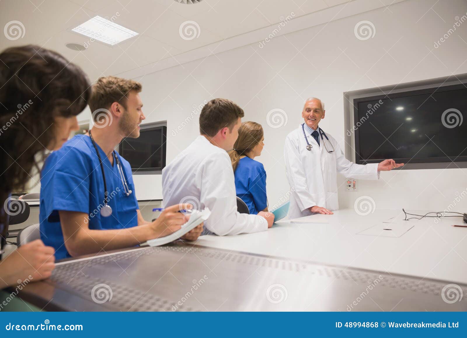 Medical Professor Teaching Young Students Stock Photo - Image of ...