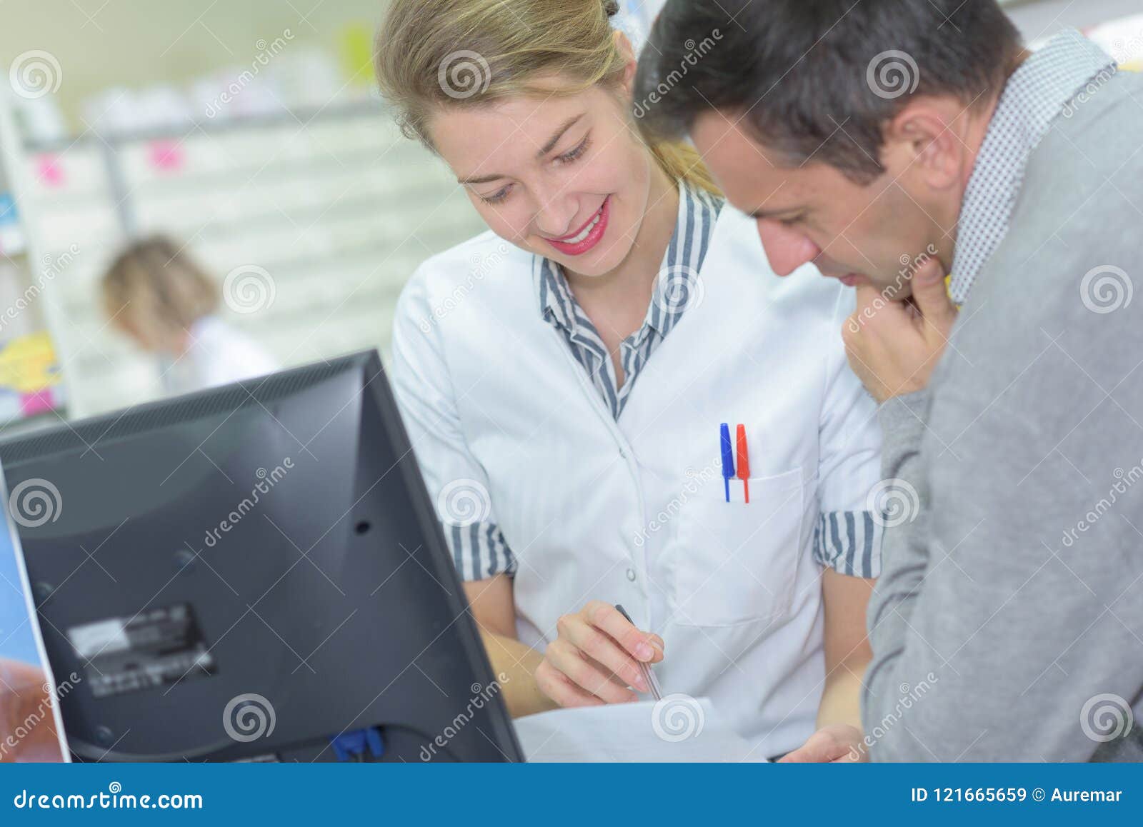 Medical Receptionist Conversing with Man Stock Image - Image of ...