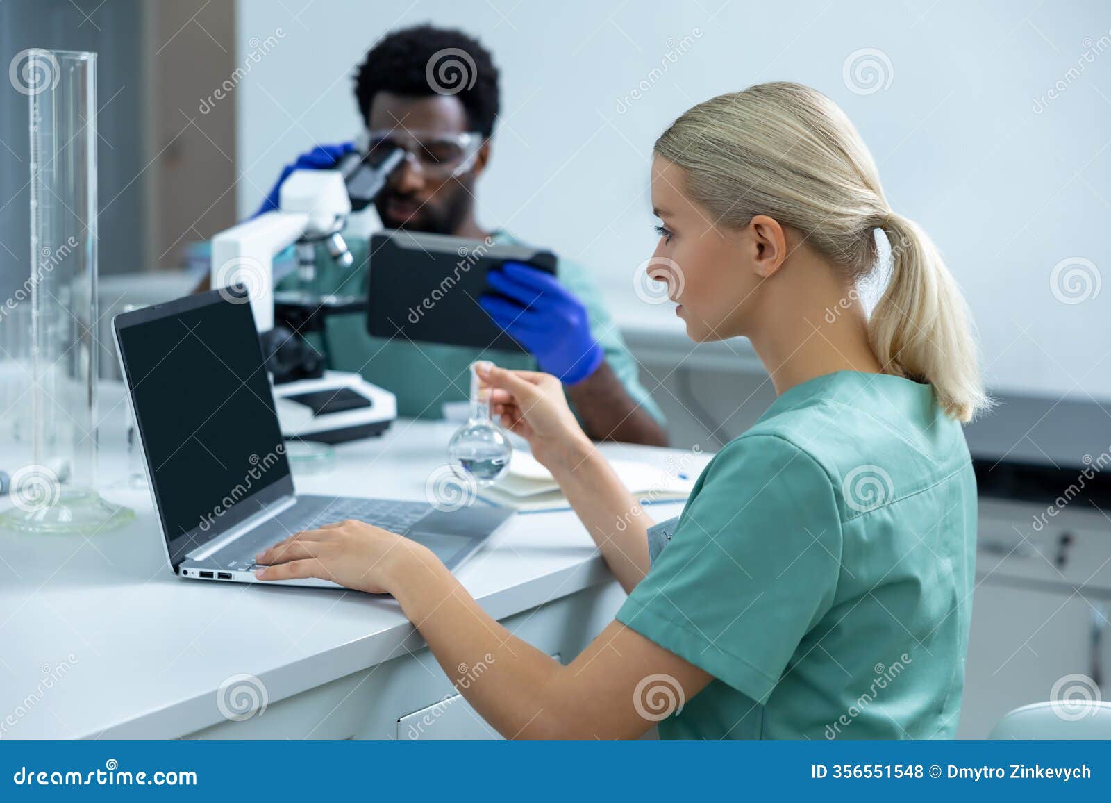 Medical Researchers in Laboratory Discussing in Pharmacology Using ...