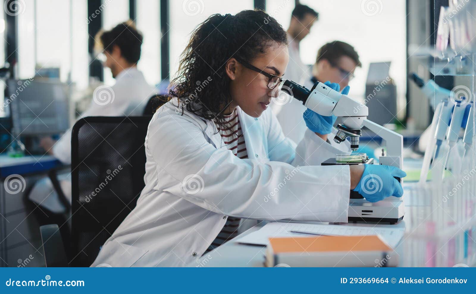 Medical Science Laboratory: Beautiful Black Scientist Looking Under ...