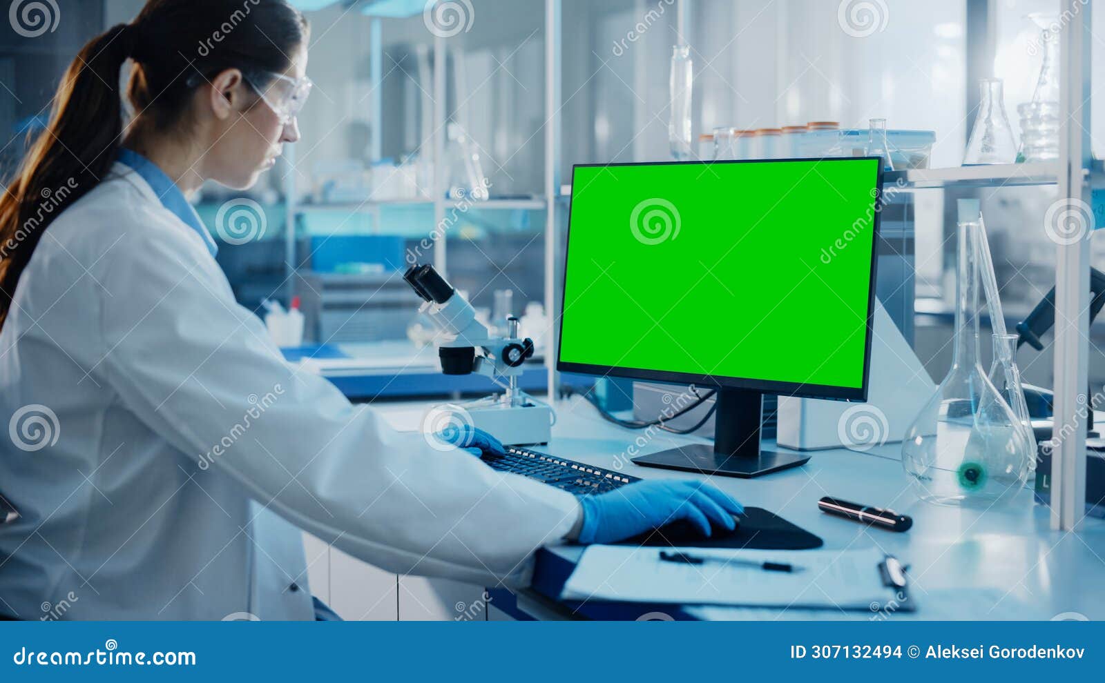 Medical Science Laboratory: Microbiologist Working on Computer with ...