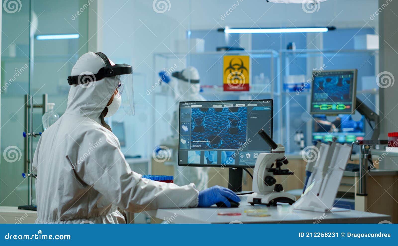 Medical Scientist in Ppe Suit Working with DNA Scan Image Typing on Pc ...