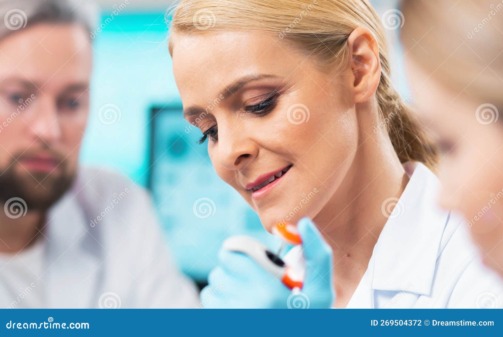 Medical Scientists Working in Lab. Doctor Teaching Interns To Make ...