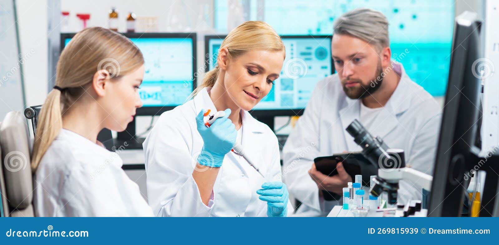 Medical Scientists Working in Lab. Doctor Teaching Interns To Make ...