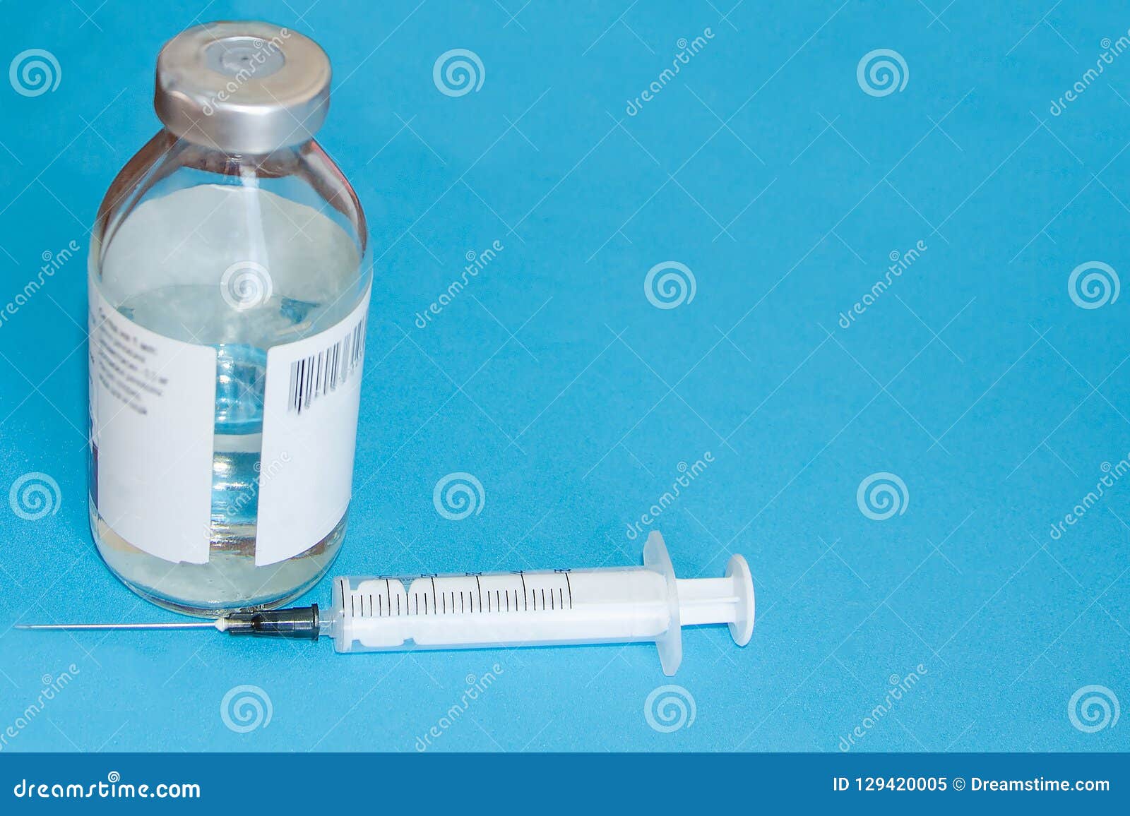 Medical Solution and Syringe Lie on a Blue Background Stock Image ...