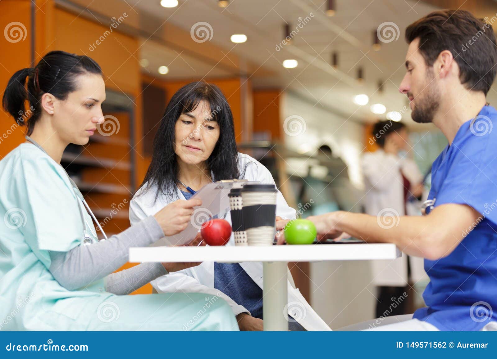 Medical Staff in Discussion while on Break Stock Photo - Image of snack ...