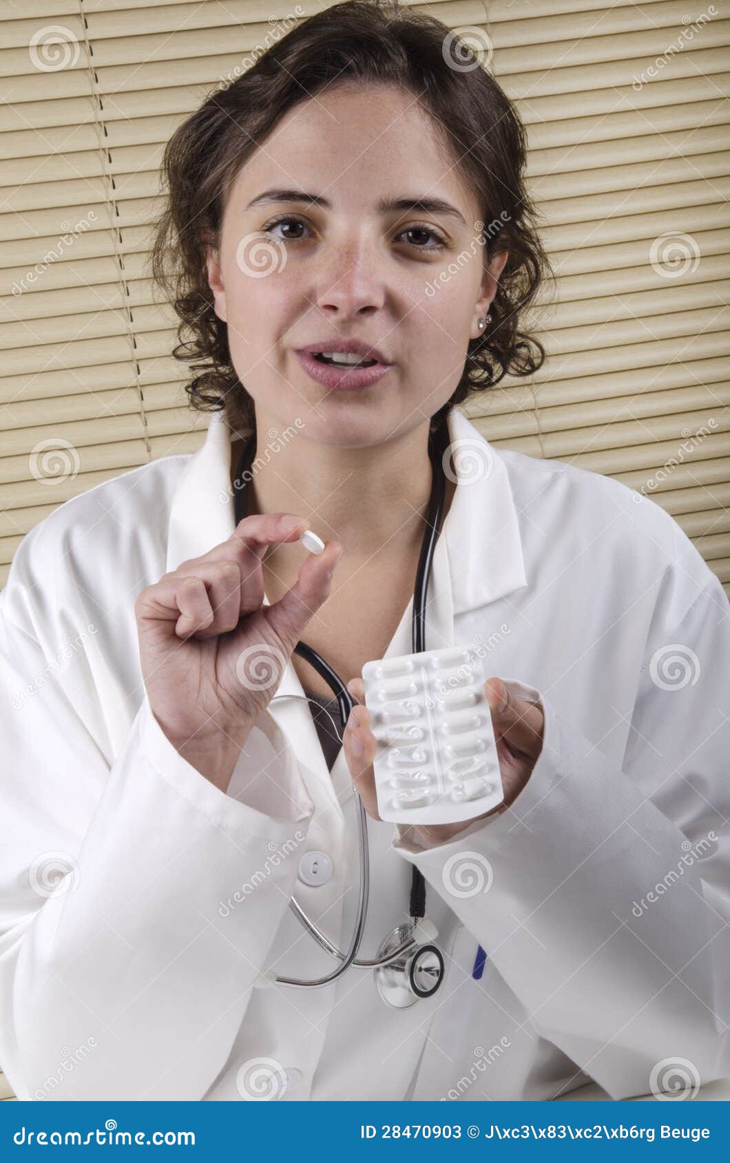 Medical Staff Holding a Tablet and a Tablets Package Stock Image ...