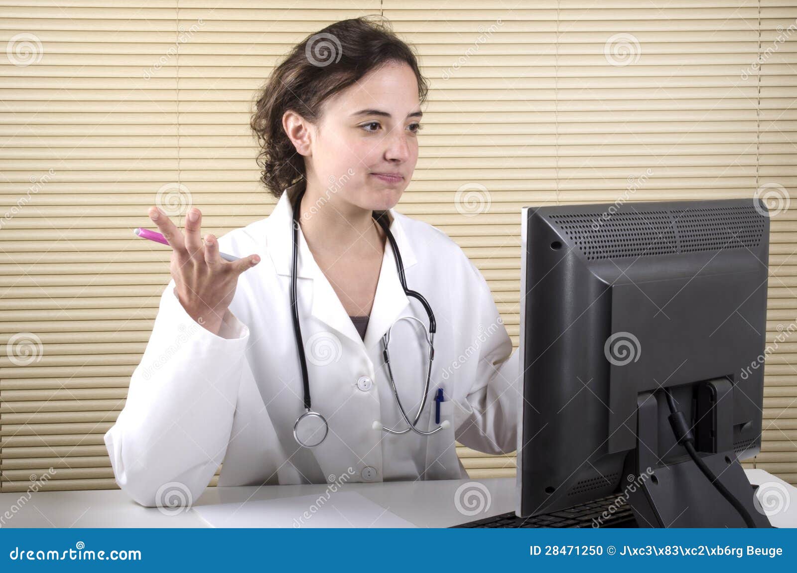Medical Staff Member at Her Desk Stock Photo - Image of practitioner ...