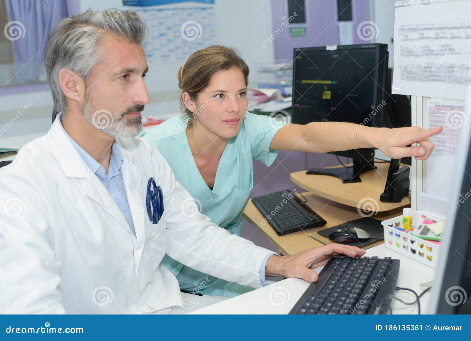 Medical Staff Using Computer and Pointing at Screen Stock Image - Image ...