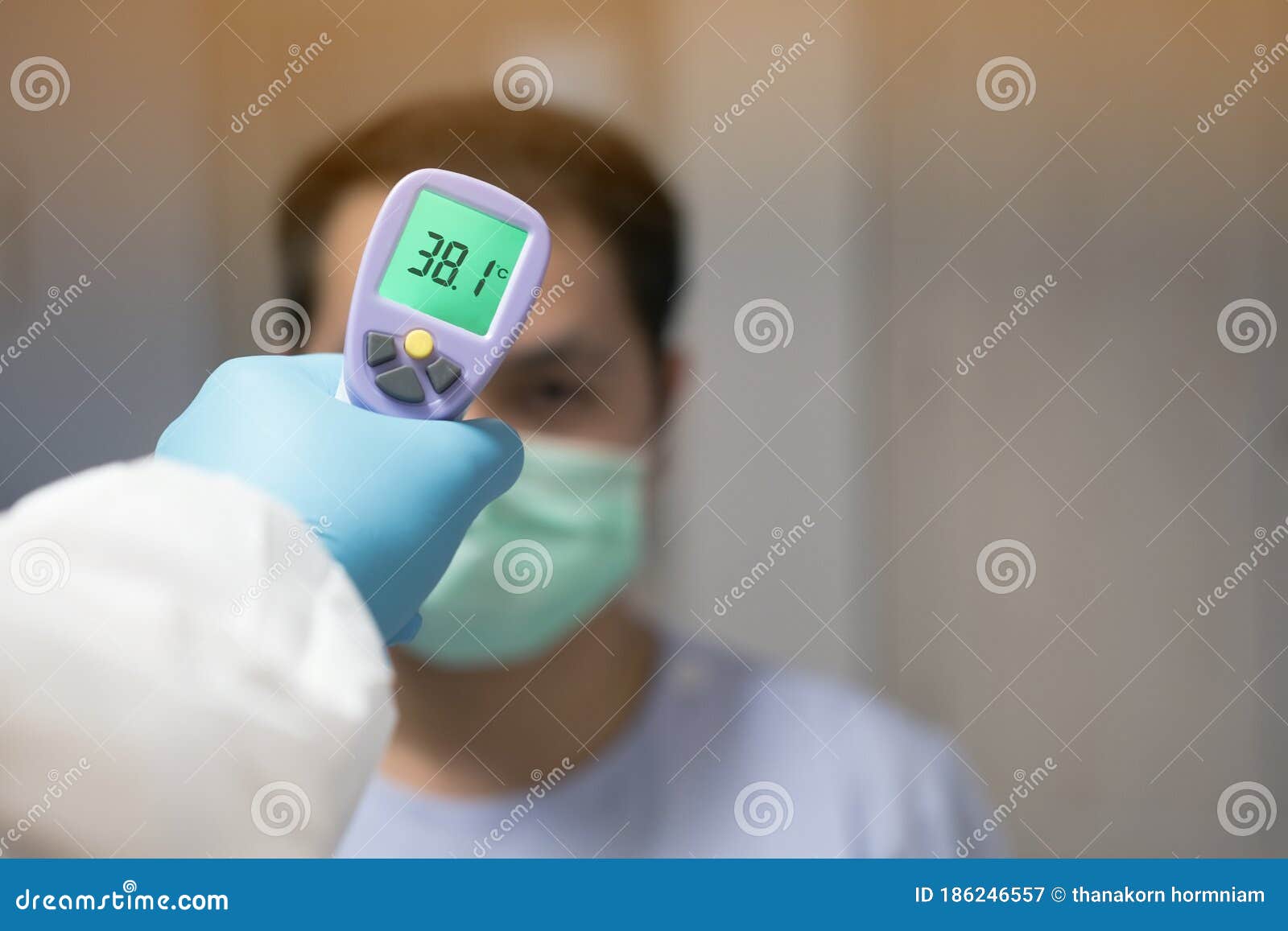 Medical Staff Using a Thermometer Gun Machine Check Body Temperature ...
