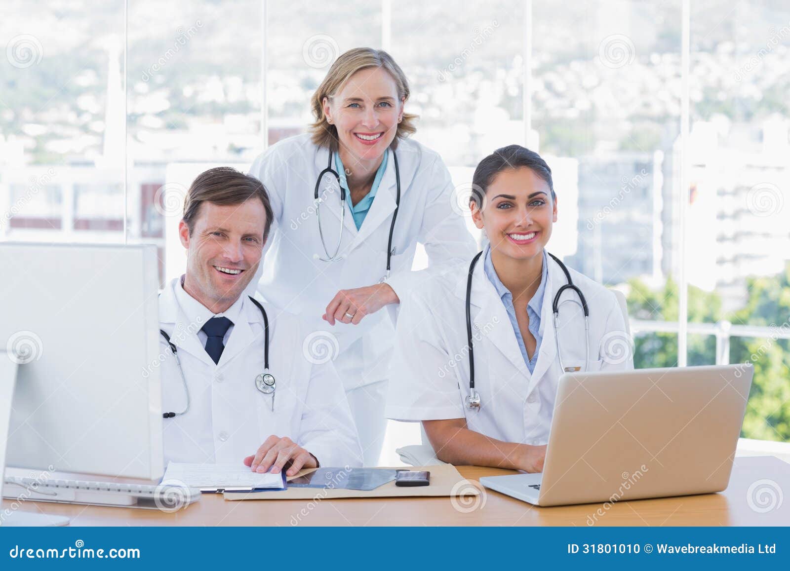 Medical Staff Working on a Laptop and a Computer Stock Photo - Image of ...