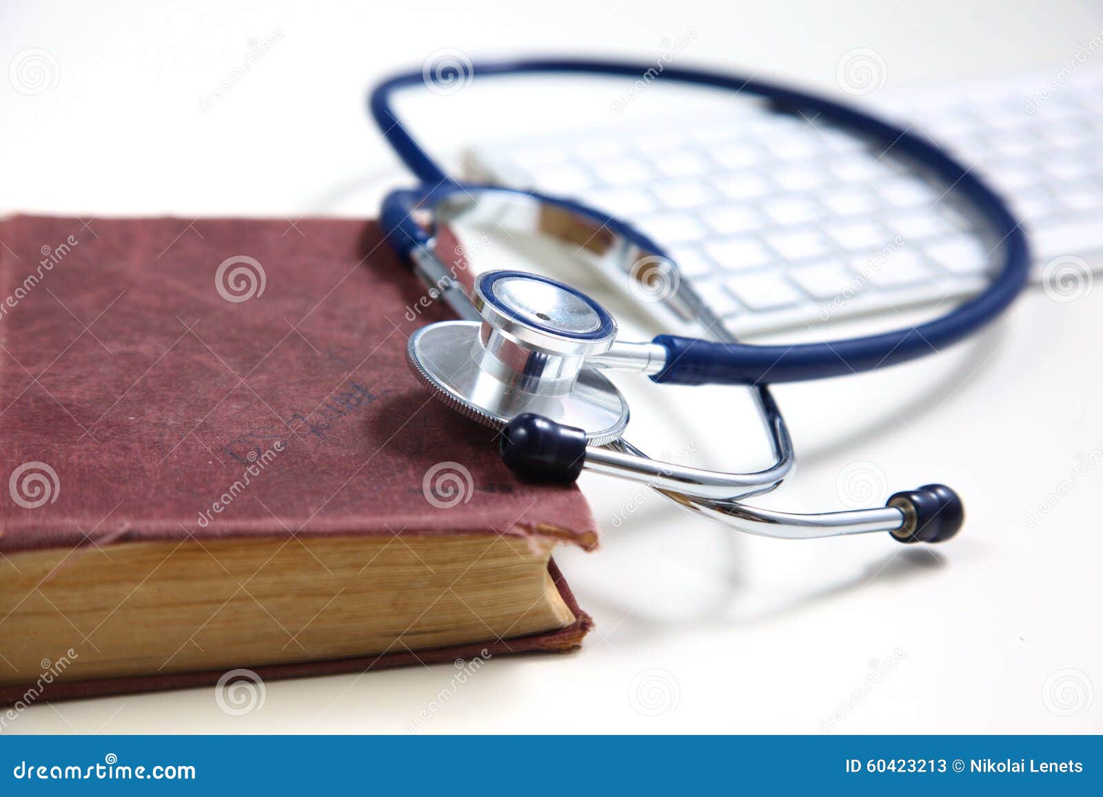 Medical Stethoscope with Old Books and Laptop on a Stock Image - Image ...