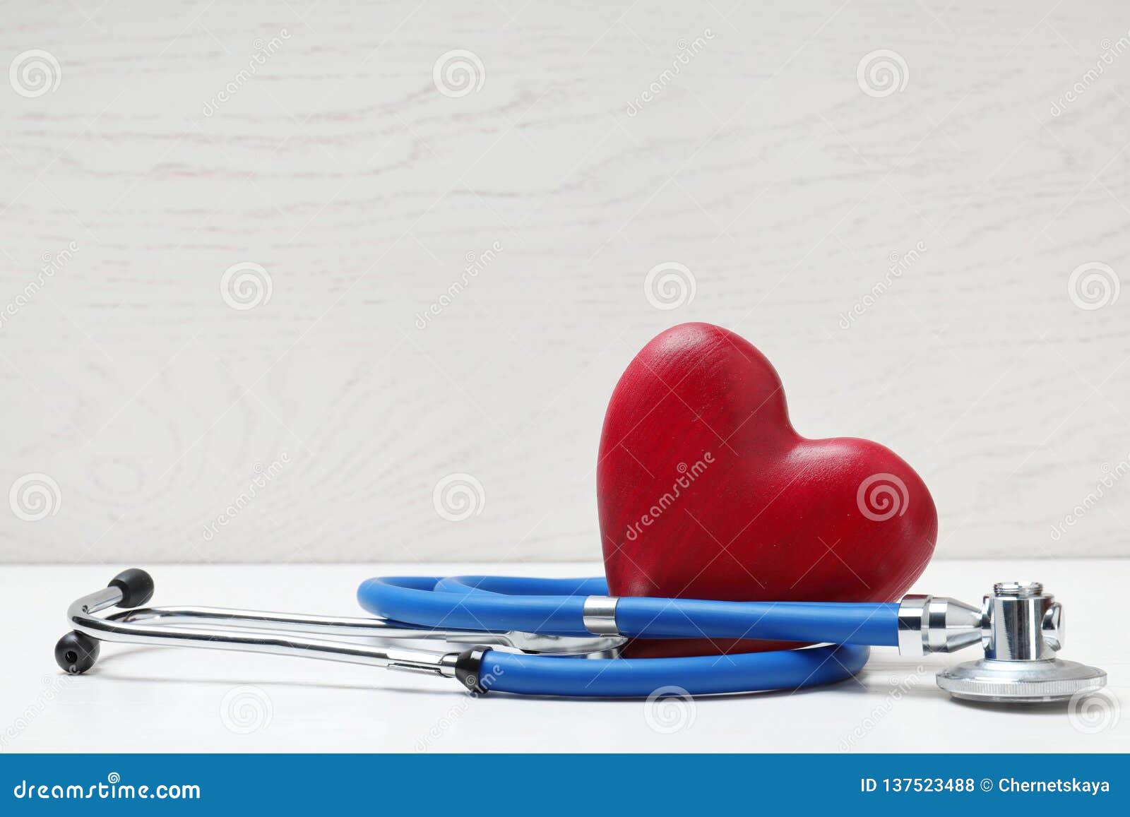 Medical Stethoscope and Wooden Heart on Table Stock Photo - Image of ...