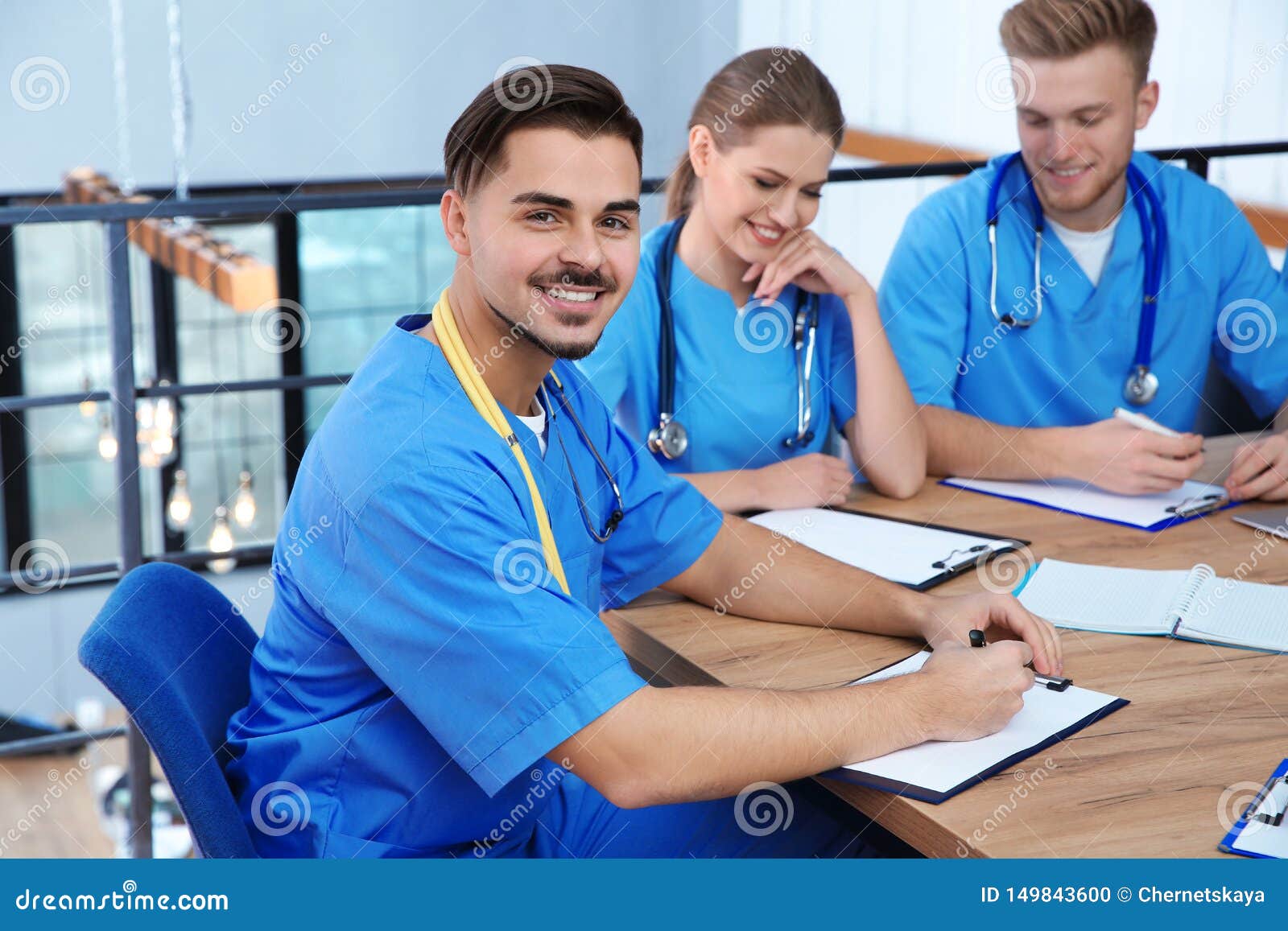 Medical Student with Groupmates in Library Stock Photo - Image of ...