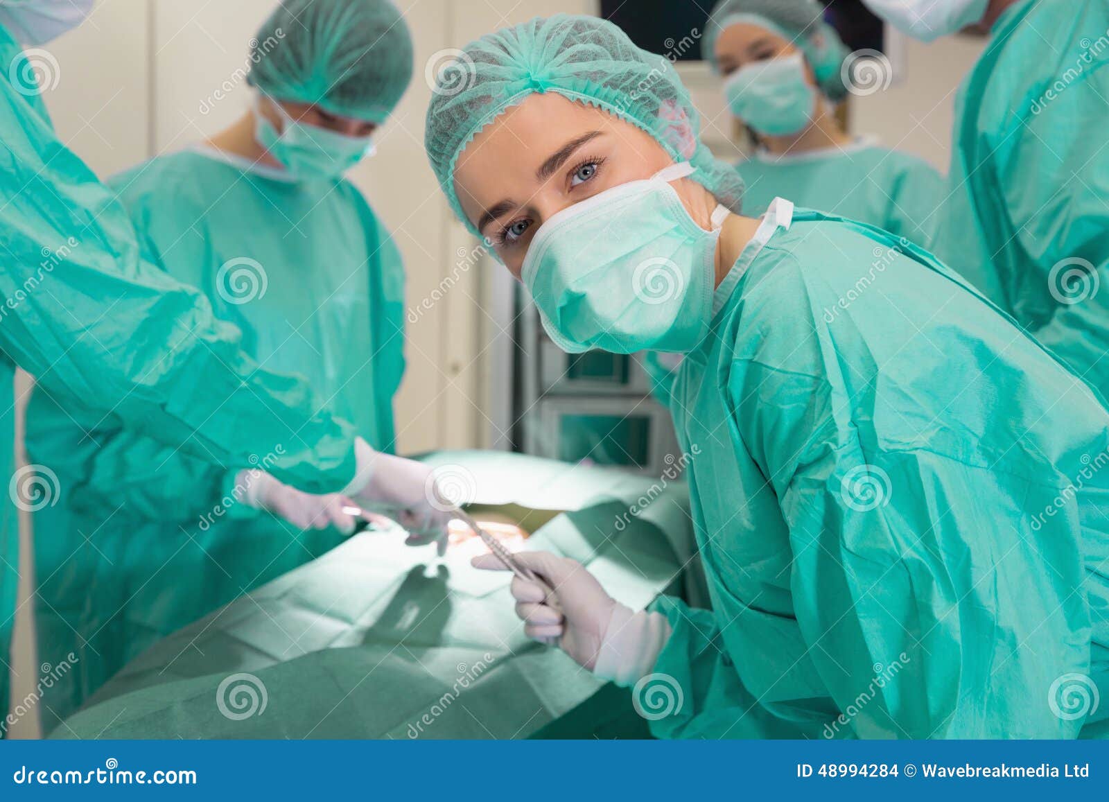 Medical Student Looking at Camera during Practice Surgery Stock Photo ...