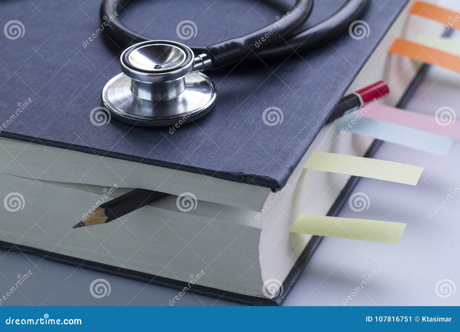 Medical Student Textbook and Pencil Stock Image - Image of reading ...