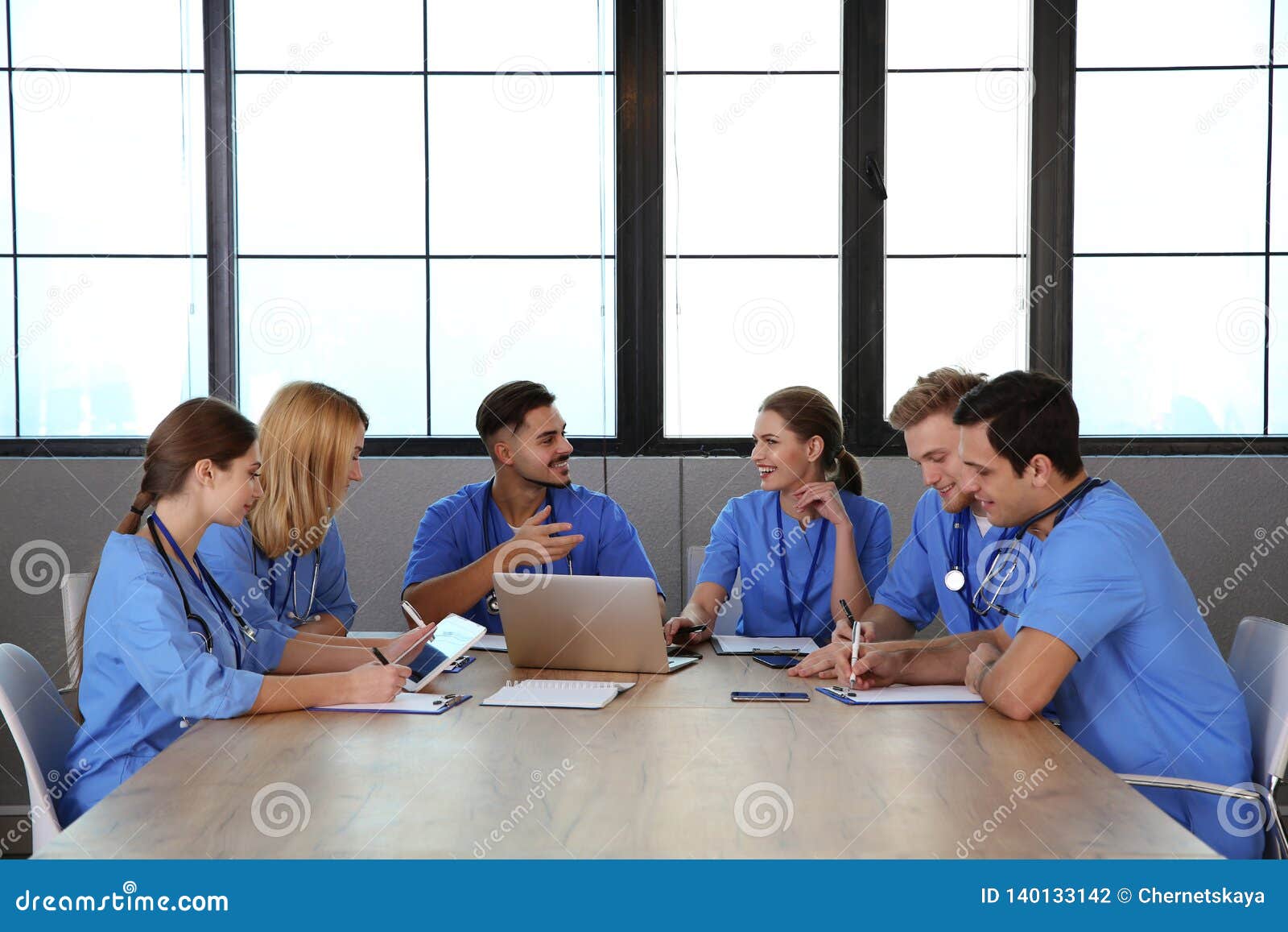 Medical Students in Uniforms Studying Stock Photo - Image of graduate ...