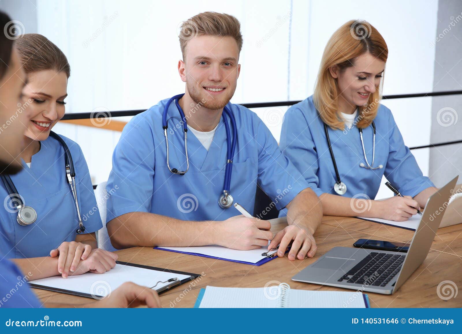 Medical Students in Uniforms Studying Stock Photo - Image of internship ...