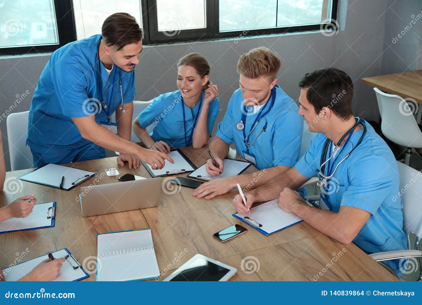 Medical Students in Uniforms Studying Stock Photo - Image of medical ...