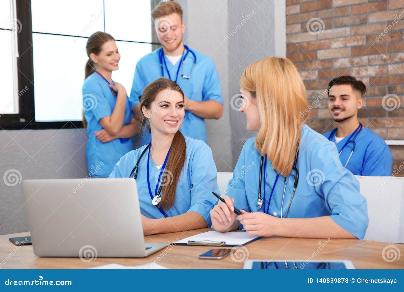 Medical Students in Uniforms Studying Stock Photo - Image of people ...