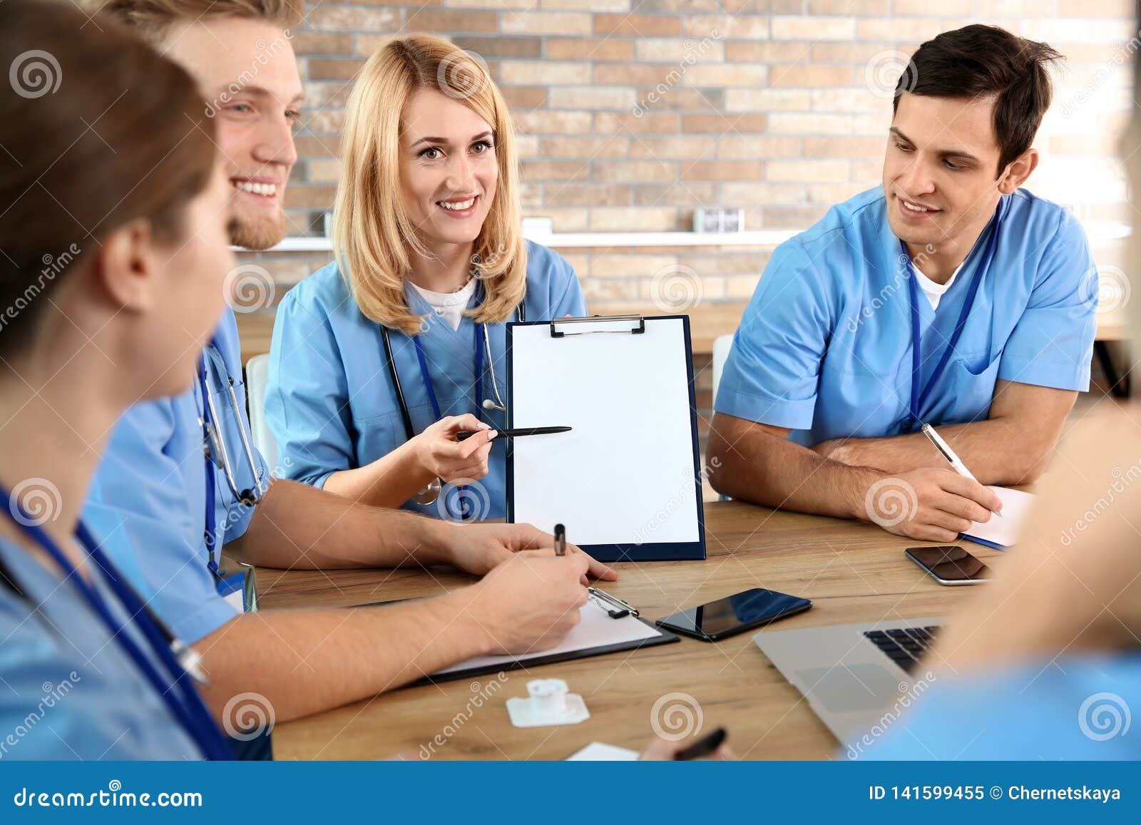 Medical Students in Uniforms Studying Stock Image - Image of female ...