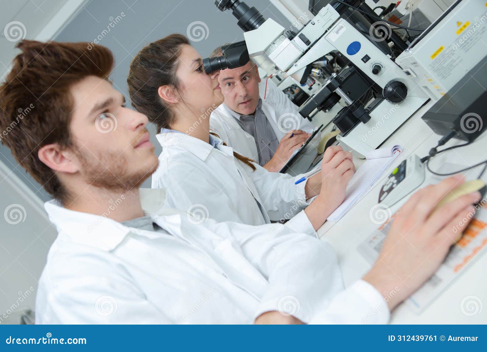 Medical Students Working with Microscope at University Stock Image ...