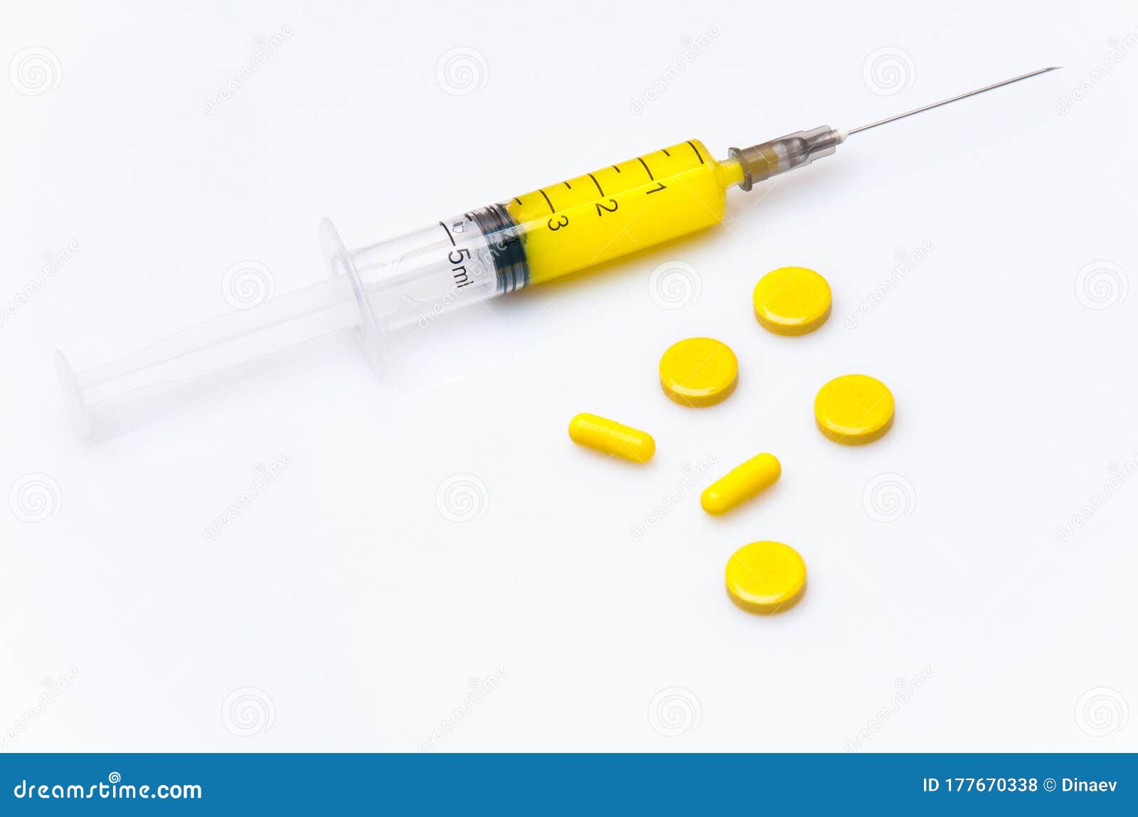 A Medical Syringe with a Yellow Solution Lies on a White Background ...