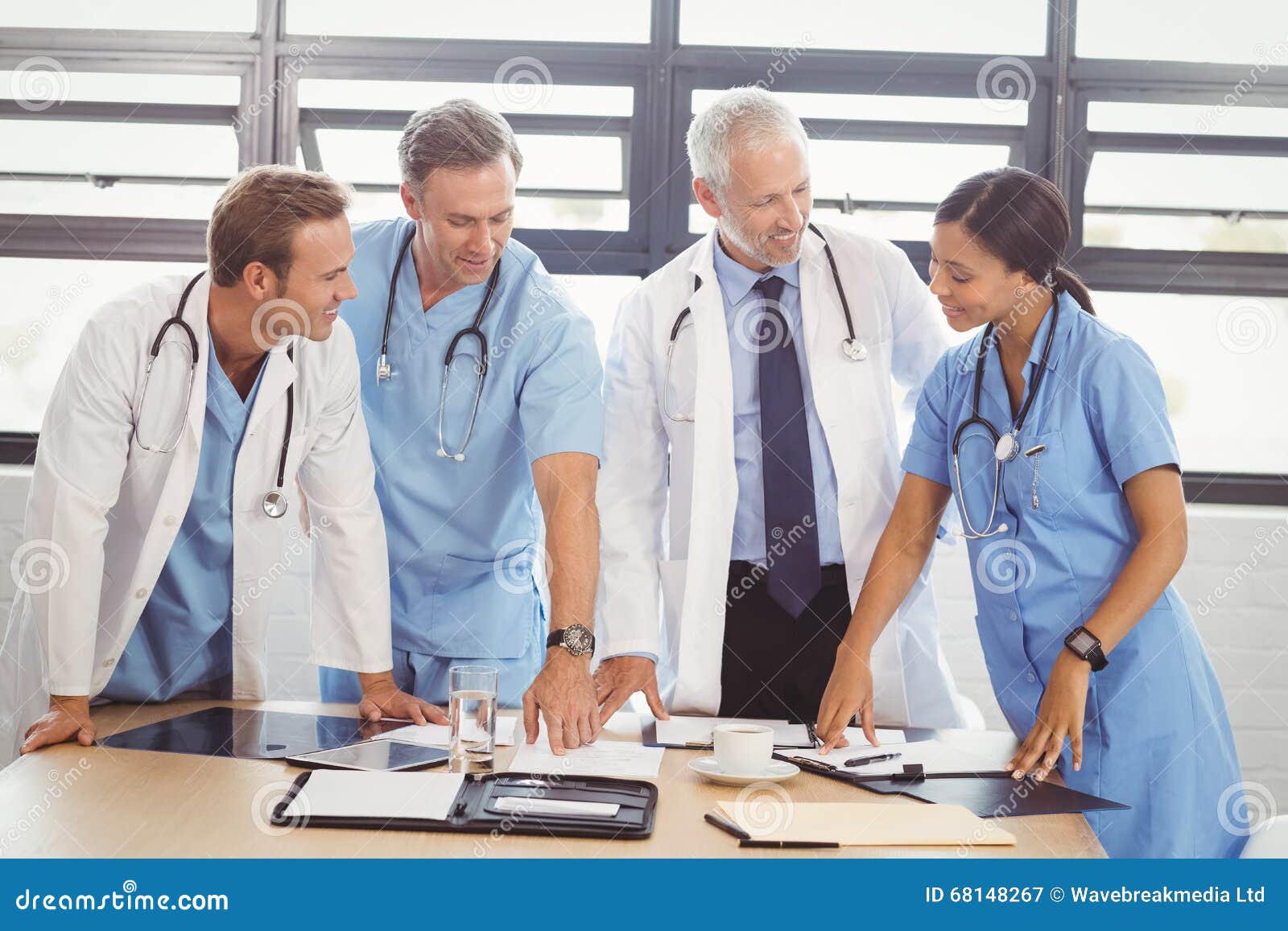 Medical Team Interacting in Conference Room Stock Image - Image of ...