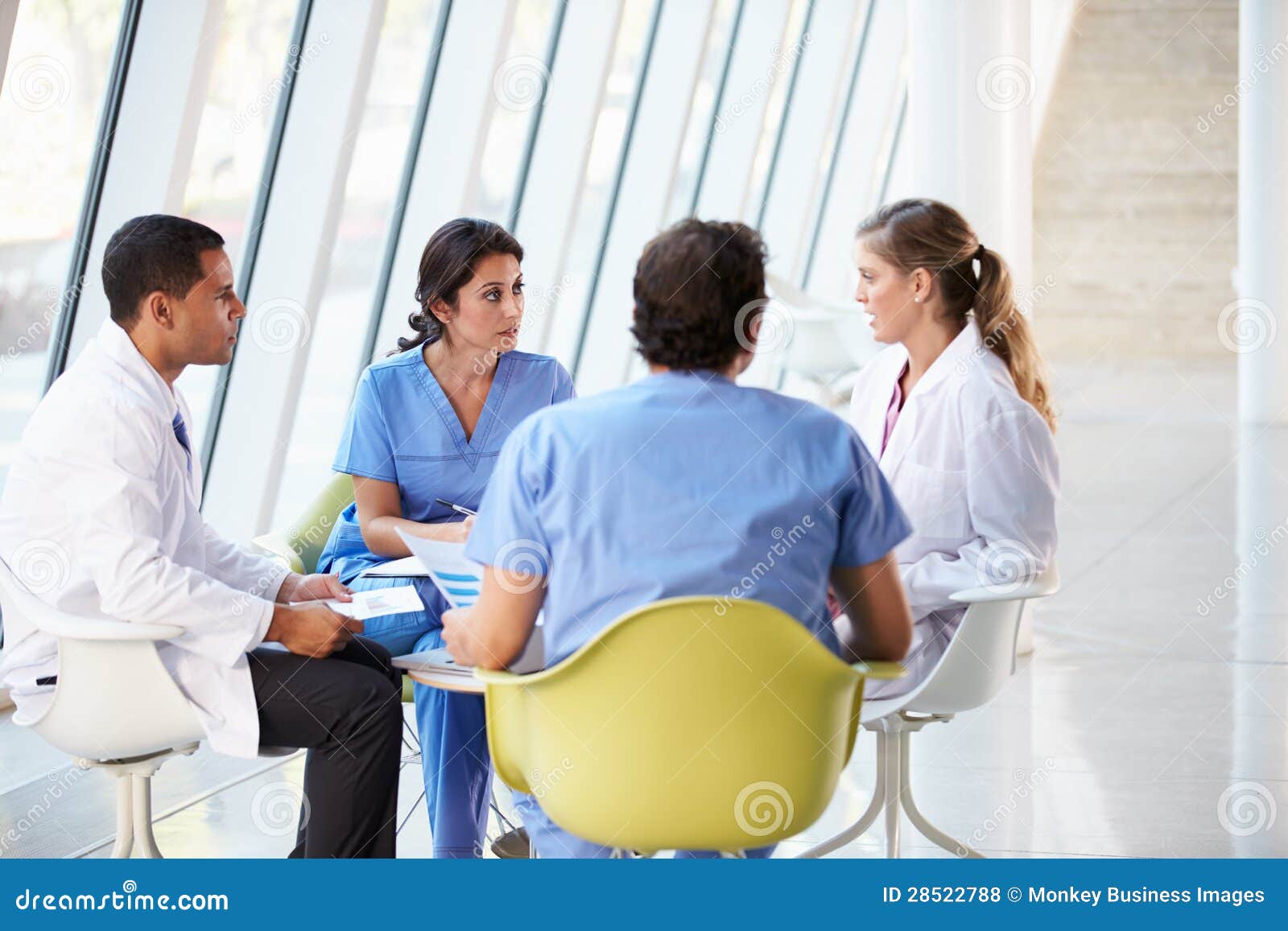 Medical Team Meeting Around Table Stock Photo - Image of coat, modern ...