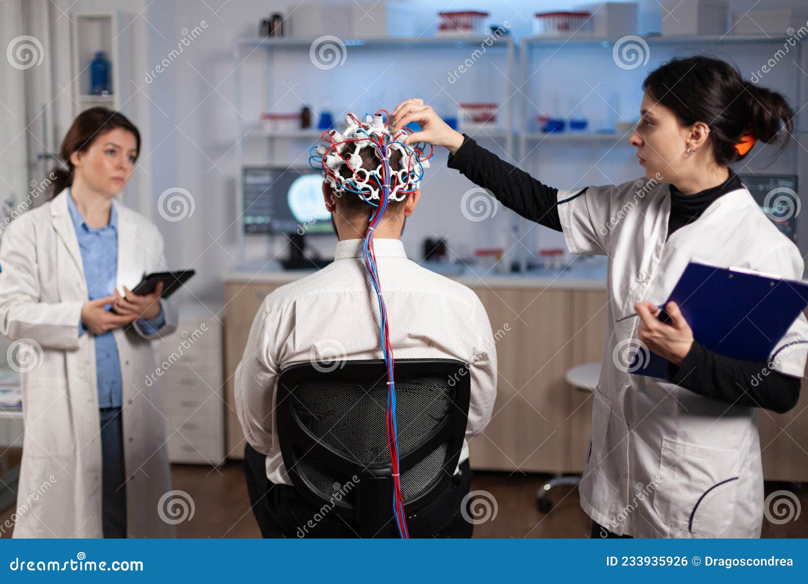 Medical Team of Neurologists Adjusting Brain Eeg Analyzing Nervous ...