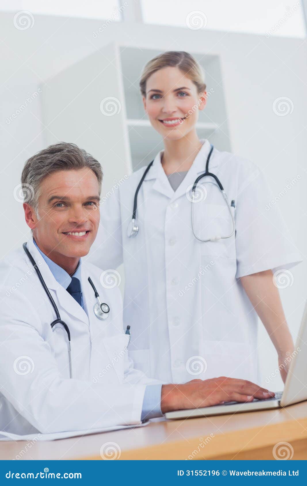 Medical Team in the Office at Desk Stock Photo - Image of coat, looking ...