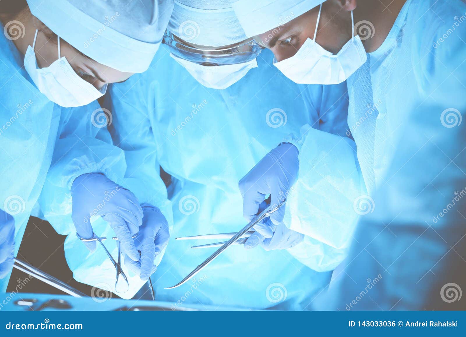 Medical Team Performing Operation. Group of Surgeons at Work in ...