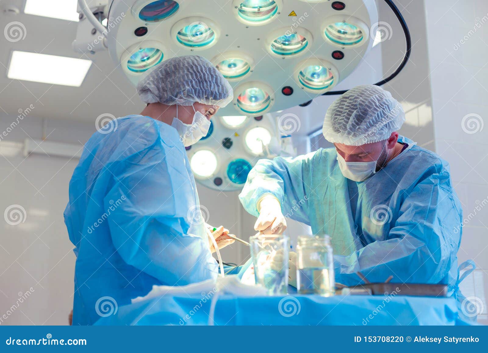 Medical Team Performing Surgical Operation in Modern Operating Room ...