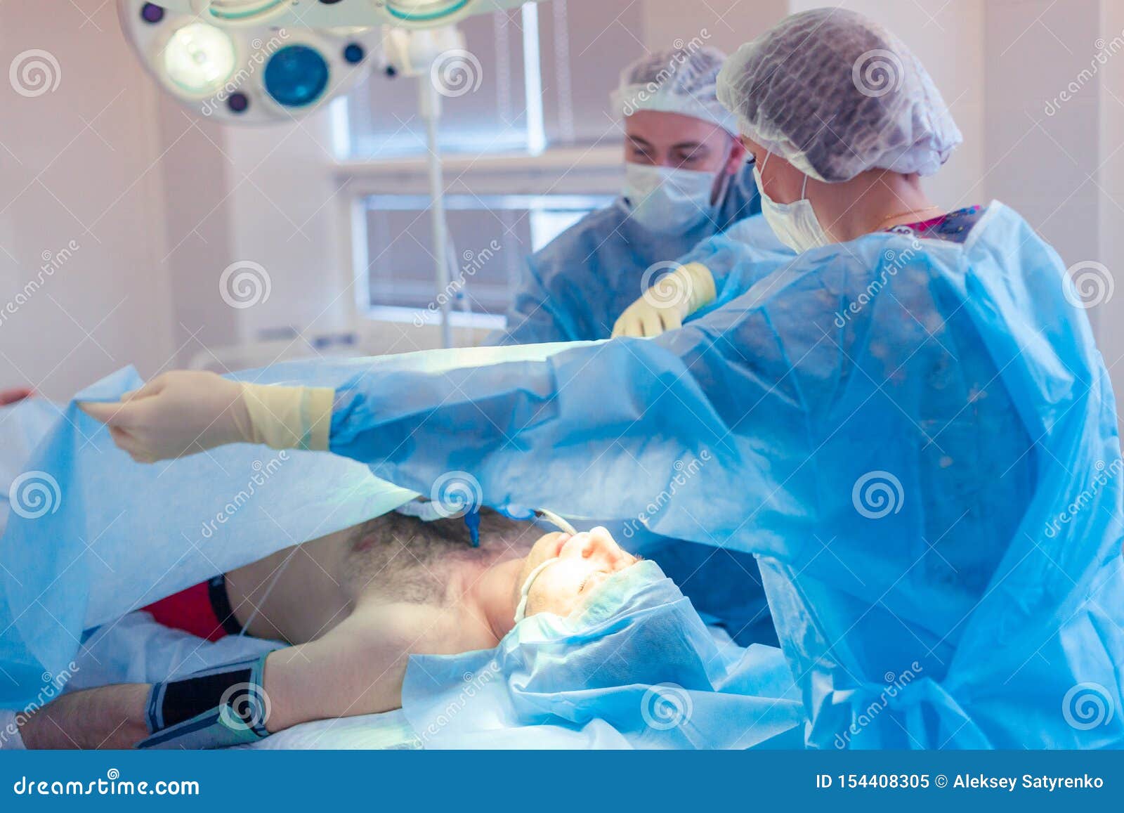 Medical Team Performing Surgical Operation in Modern Operating Room ...