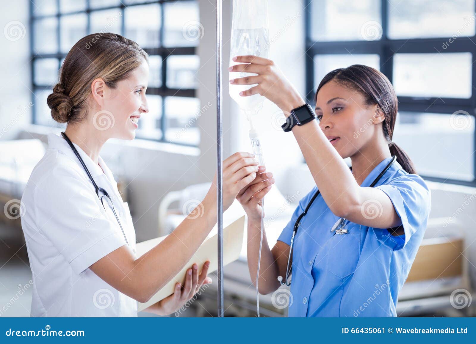 Medical Team Preparing an IV Drip Stock Image - Image of caucasian ...