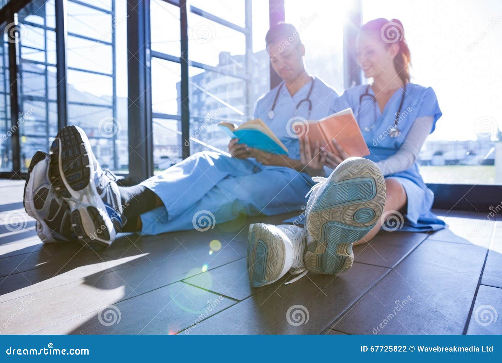 Medical team reading book stock photo. Image of health - 67725822
