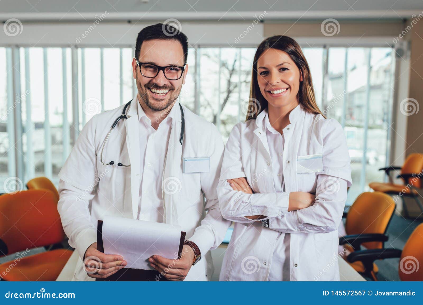 Medical Team Sitting and Discussing at the Table Stock Image - Image of ...