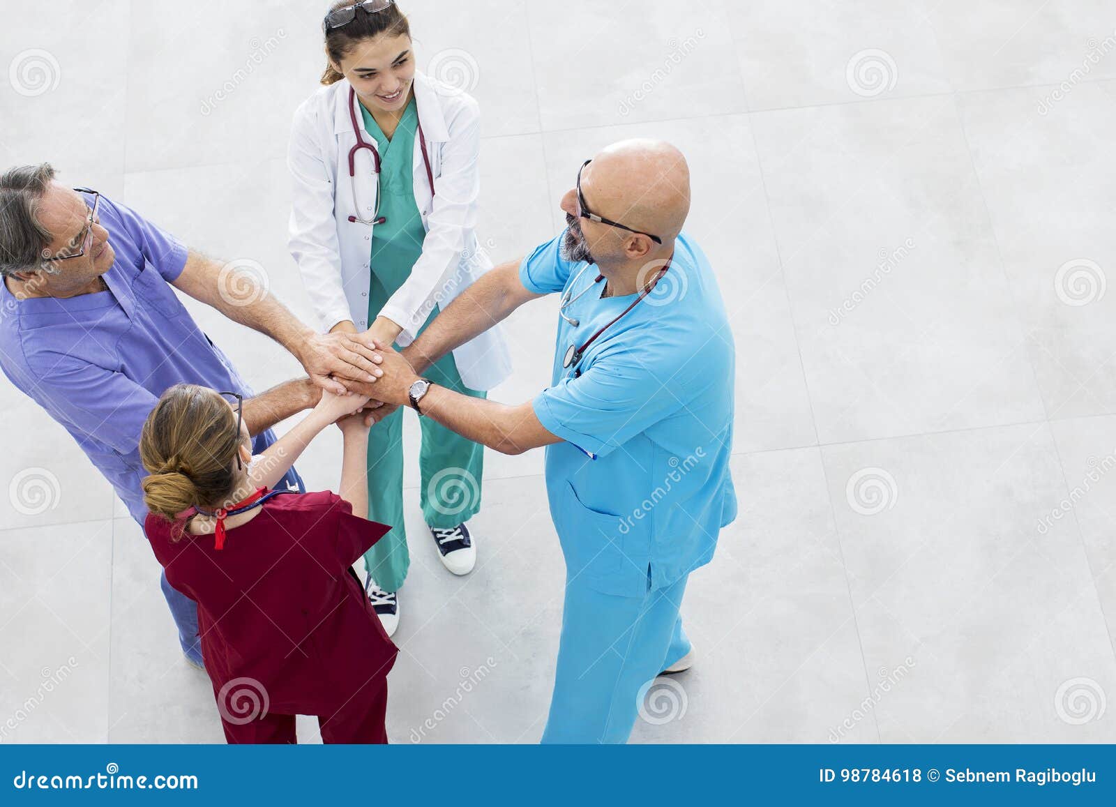 Medical Team Stacking Hands Stock Photo - Image of doctor, angle: 98784618