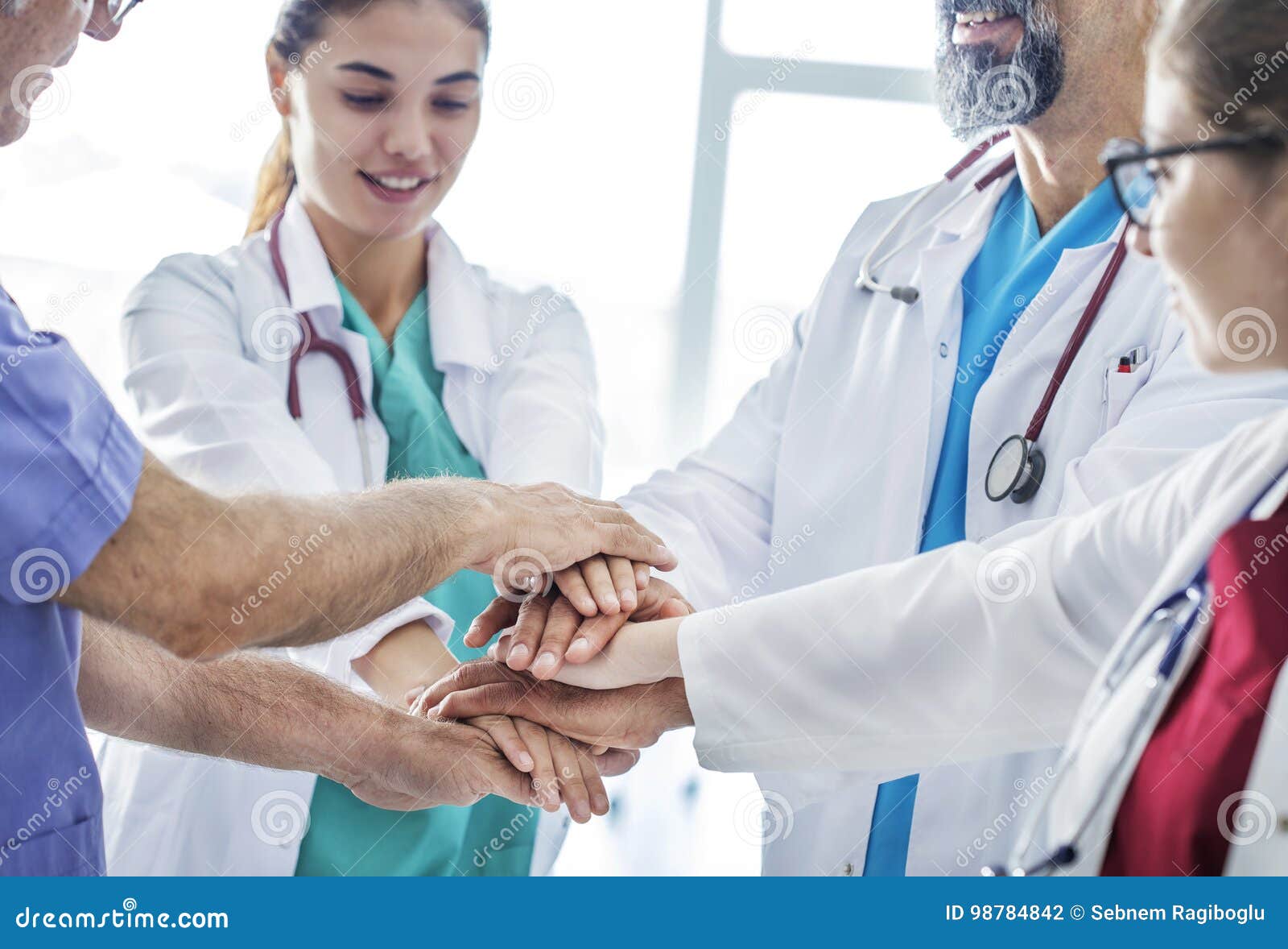 Medical Team Stacking Hands Stock Photo - Image of diverse, teamwork ...